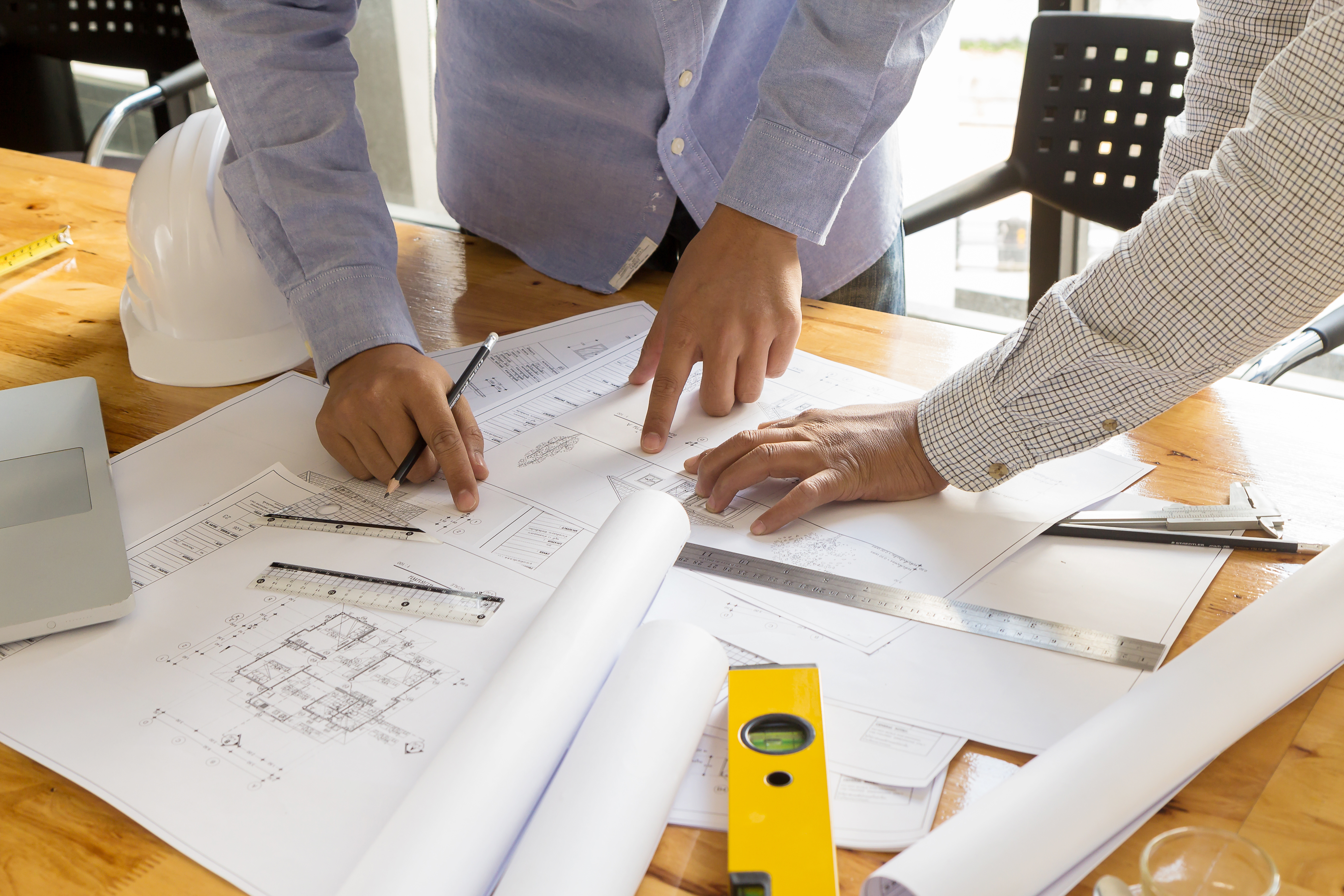 architect point at blueprint, architectural concept - Senecal ...